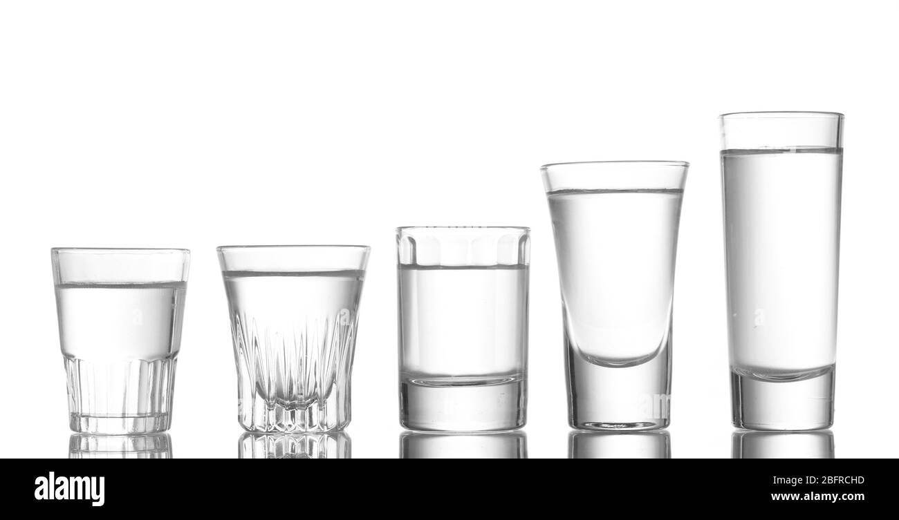 Many glass of vodka isolated on white Stock Photo - Alamy