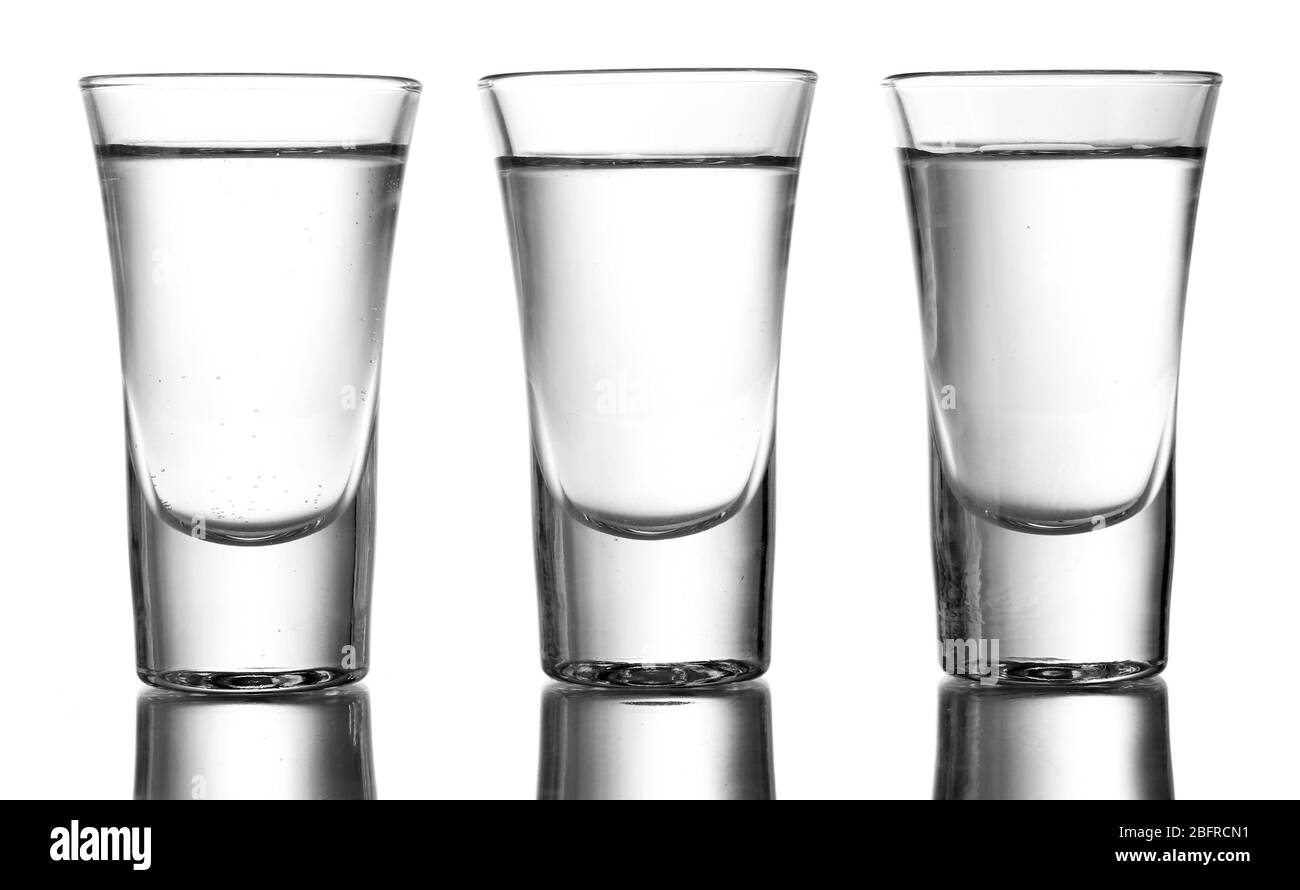 Three glass of vodka isolated on white Stock Photo - Alamy
