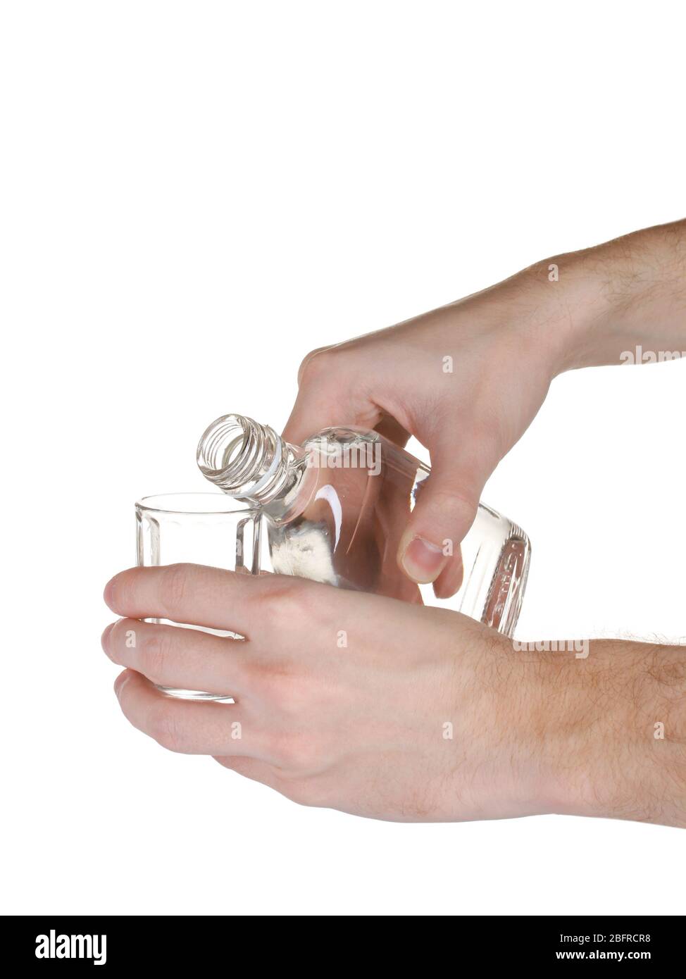 Vodka poured into a glass isolated on white Stock Photo - Alamy