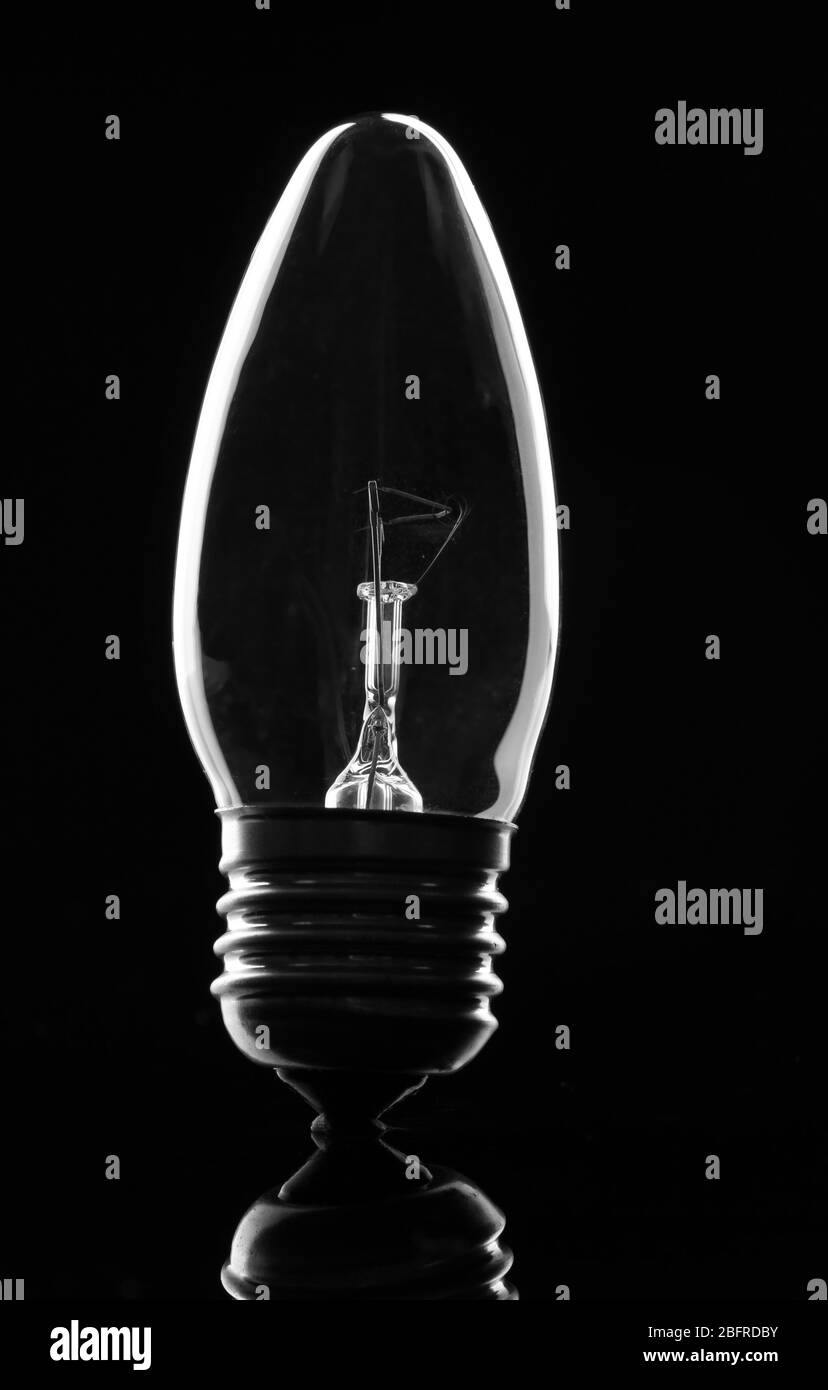 Light bulb on black background Stock Photo - Alamy