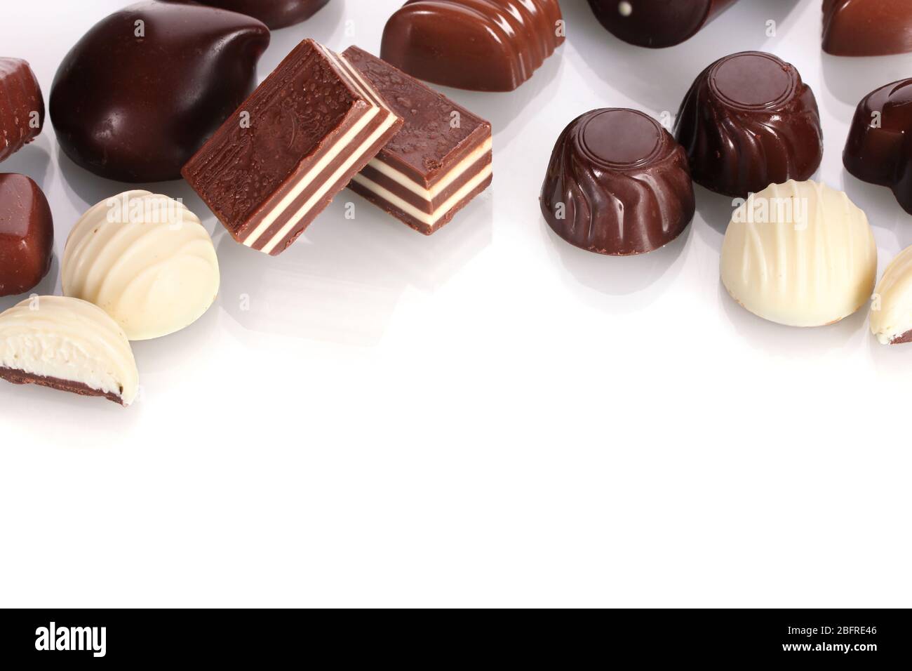 Many different chocolate candy isolated on white Stock Photo - Alamy