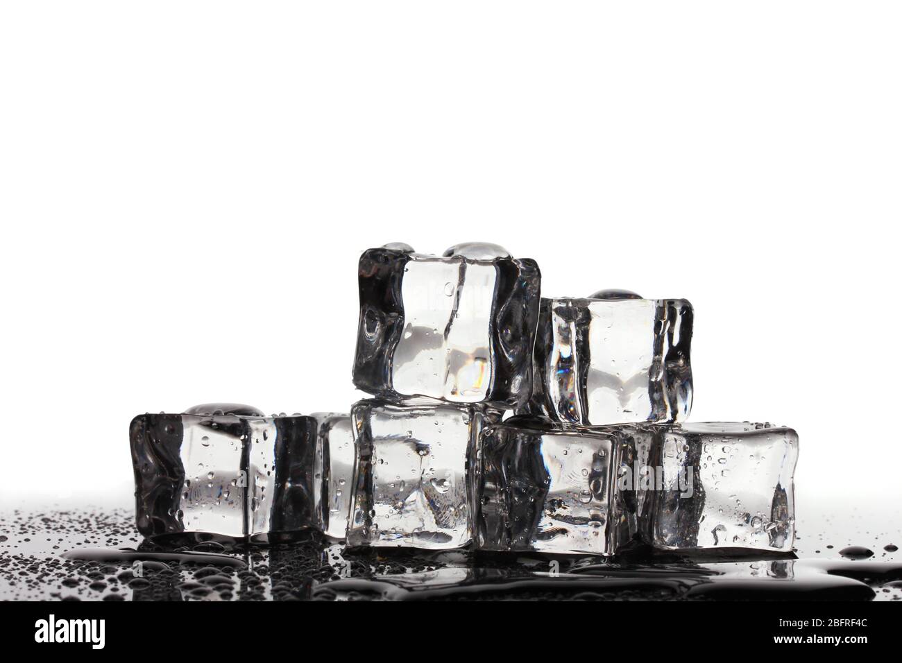 Melting ice cubes isolated on white Stock Photo - Alamy