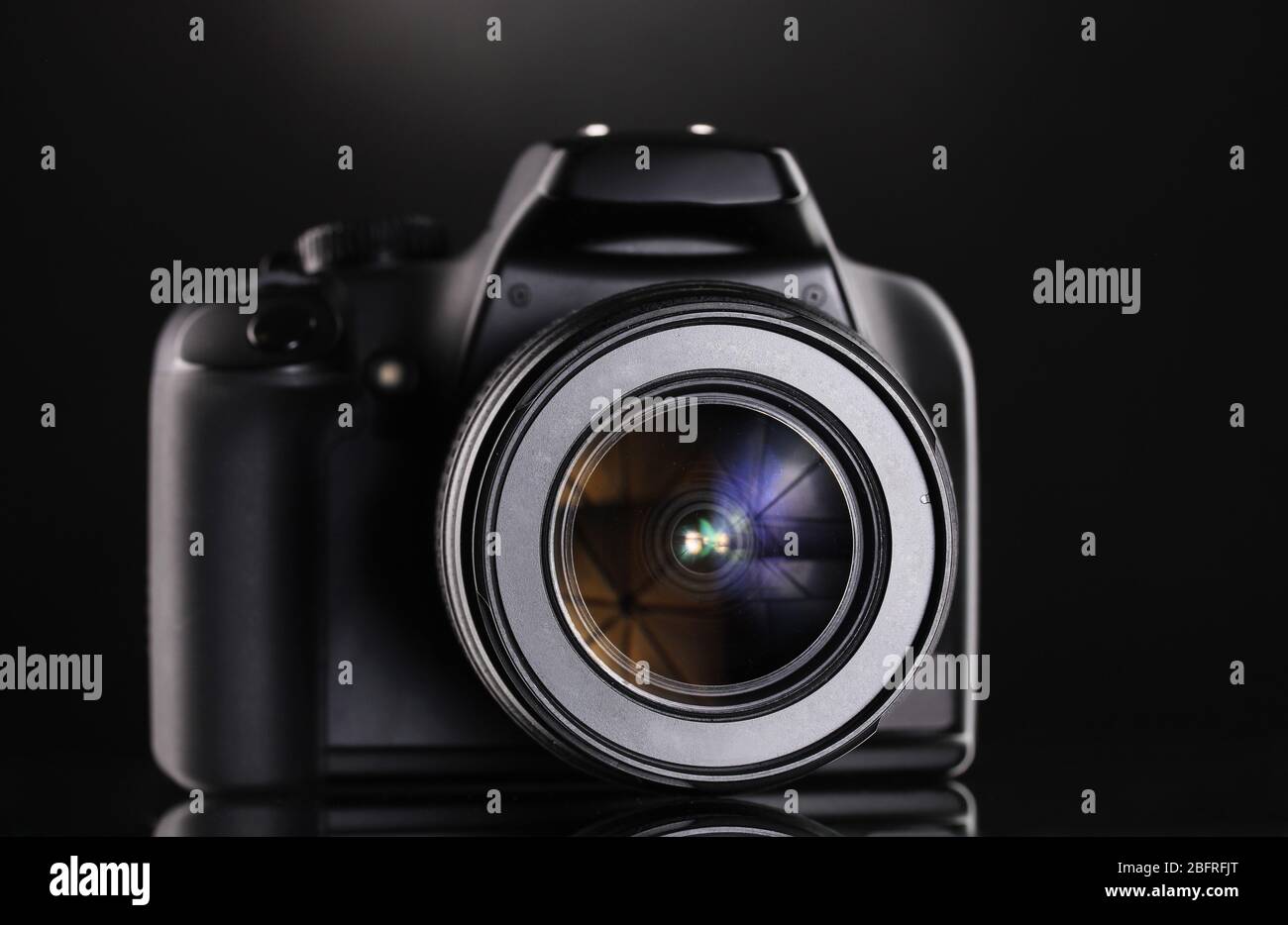 Black photocamera on black background Stock Photo - Alamy