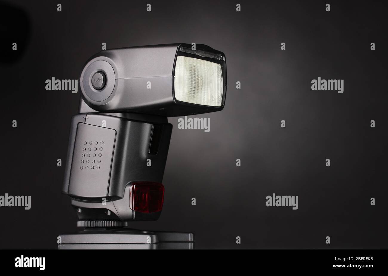 Photo camera flash on black background Stock Photo - Alamy