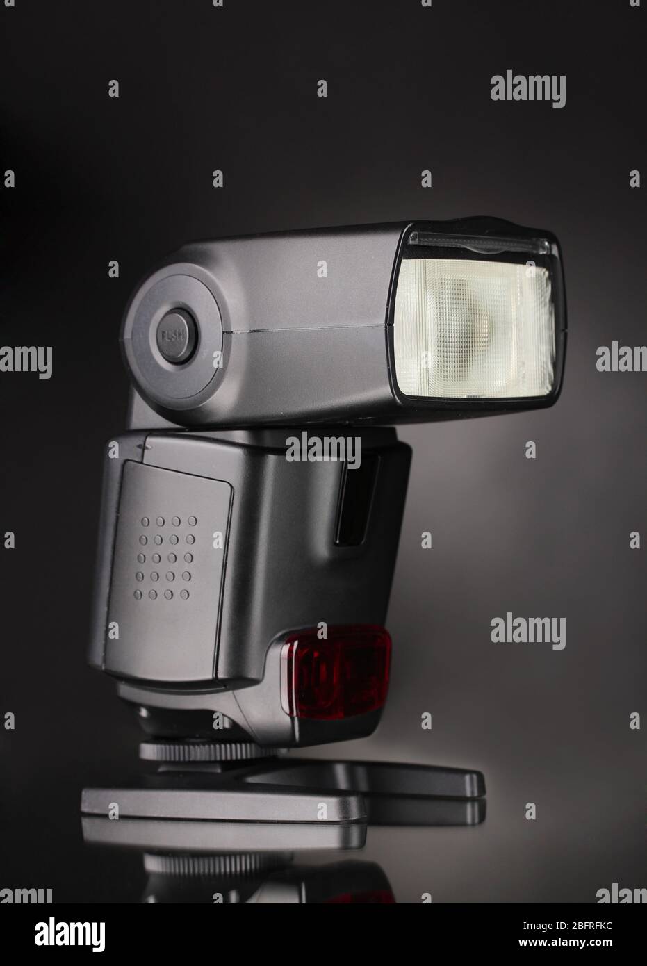 Photo camera flash on black background Stock Photo - Alamy