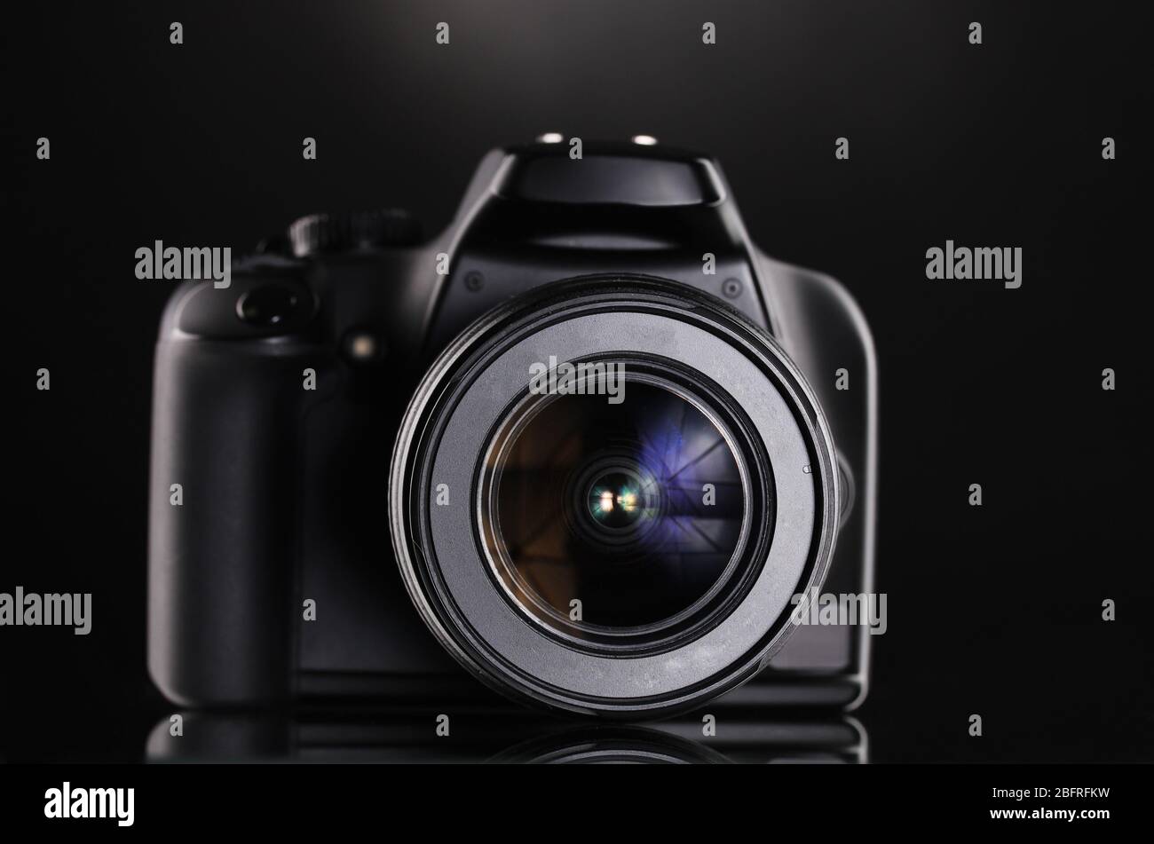 Black photocamera on black background Stock Photo - Alamy