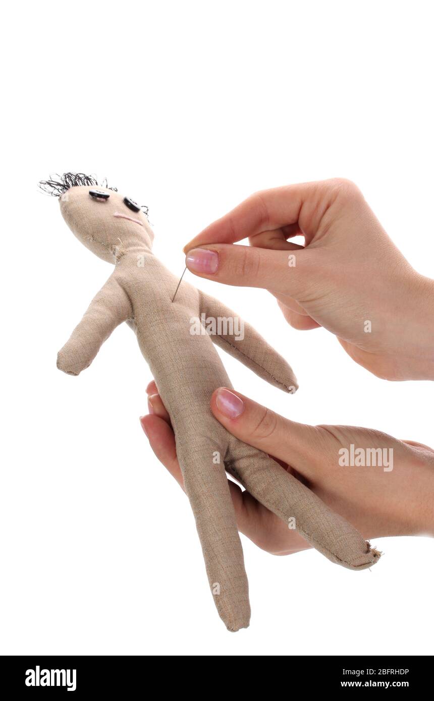 Voodoo doll boy in the hands of women isolated on white Stock Photo - Alamy