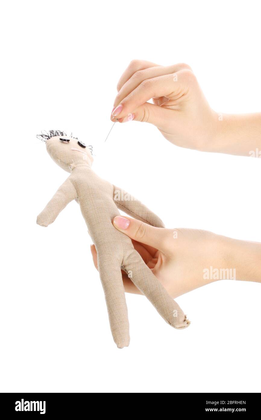Voodoo doll boy in the hands of women isolated on white Stock Photo - Alamy