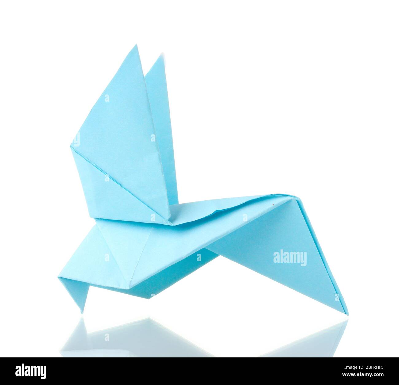 Origami pigeon out of the blue paper isolated on white Stock Photo - Alamy