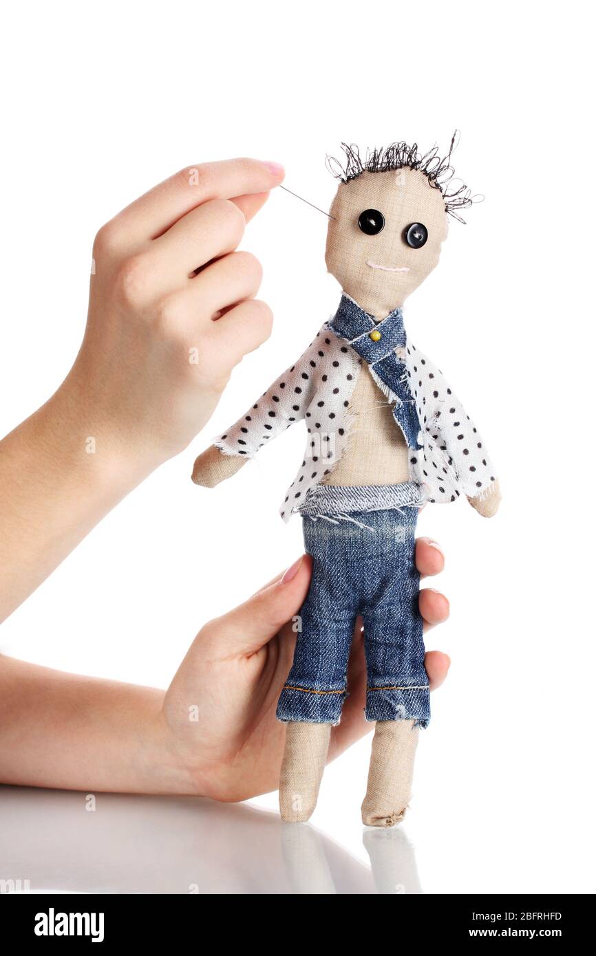Voodoo doll boy in the hands of women isolated on white Stock Photo - Alamy