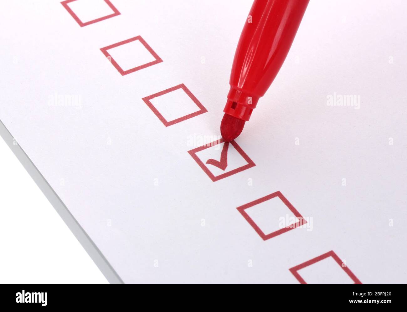 Checklist and red marker closeup Stock Photo - Alamy