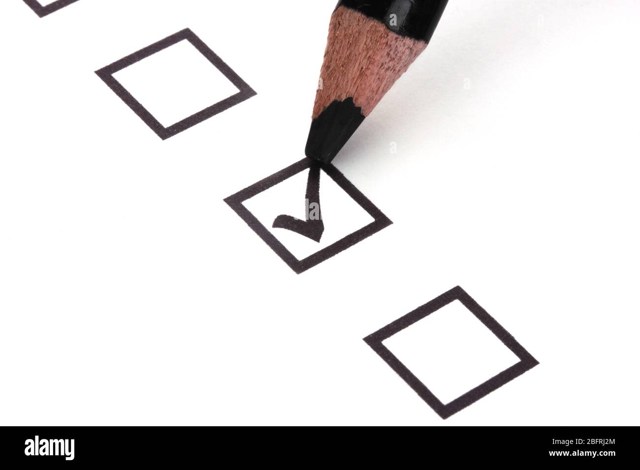 Checklist and black pencil closeup Stock Photo - Alamy