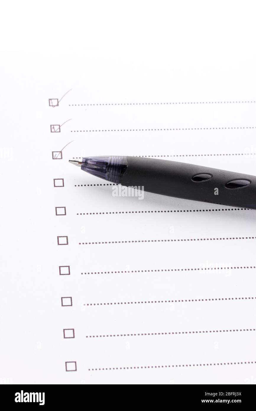 Checklist and pen closeup Stock Photo - Alamy