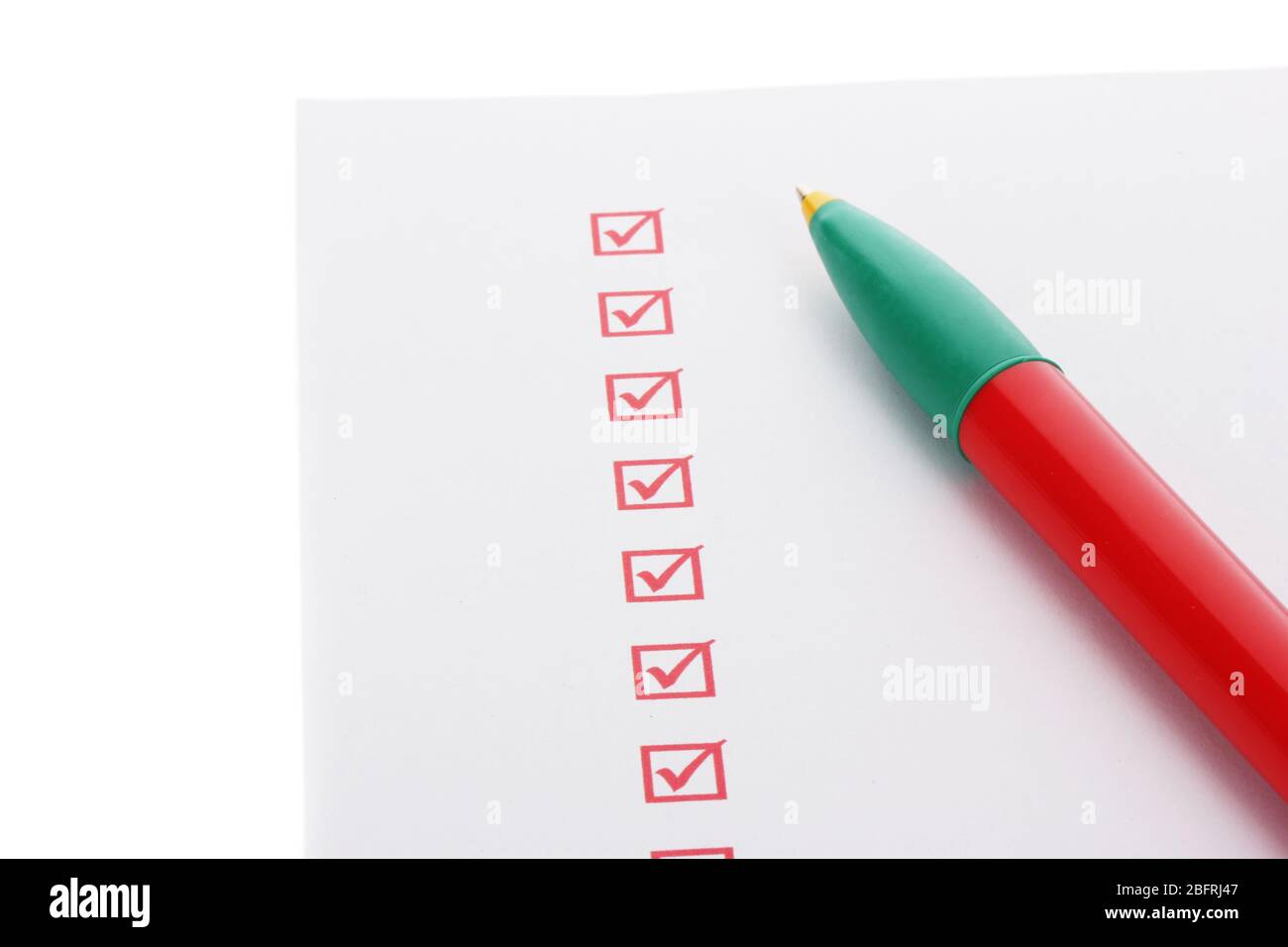Checklist and pen isolated on white Stock Photo - Alamy