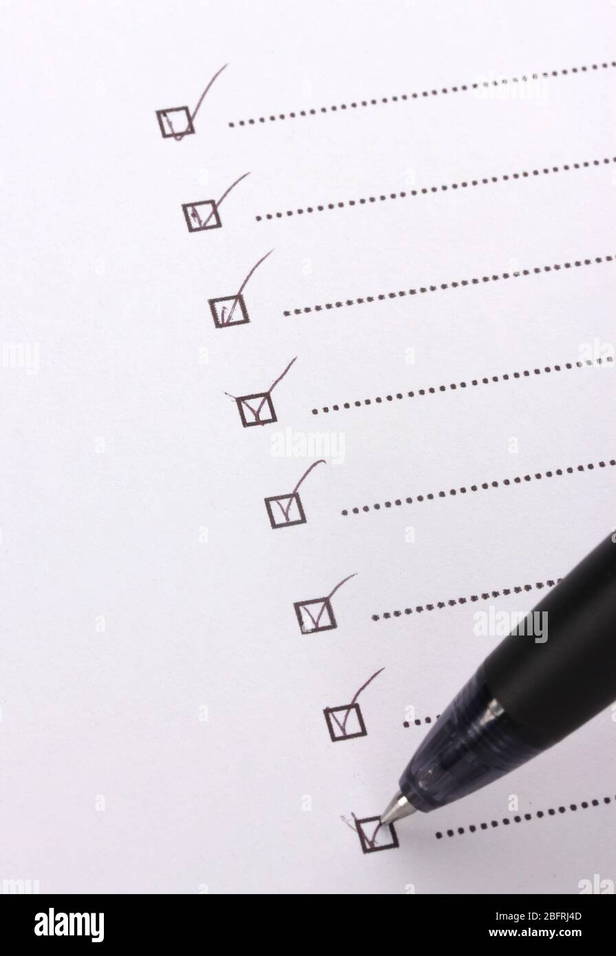 Checklist and pen closeup Stock Photo - Alamy