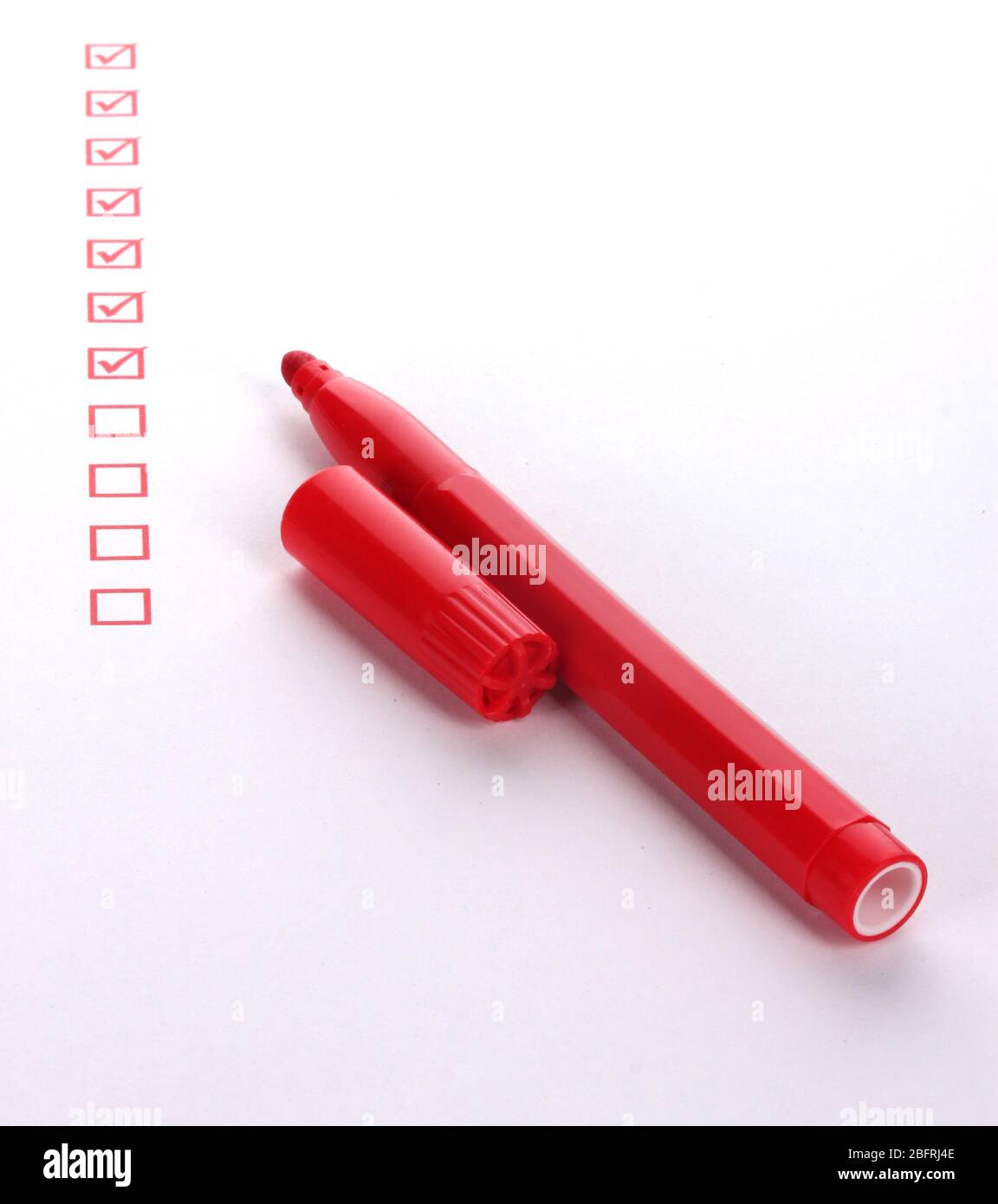 Checklist and red marker isolated on white Stock Photo - Alamy