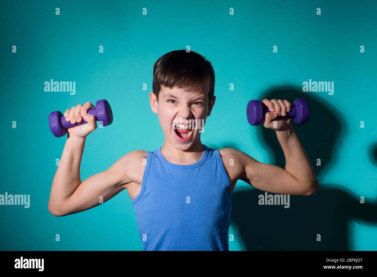 Boy with dumbbells hi-res stock photography and images - Alamy