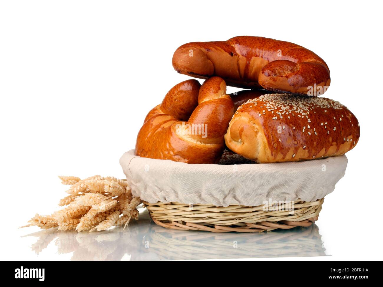 Baked bread in basket isolated on white Stock Photo - Alamy