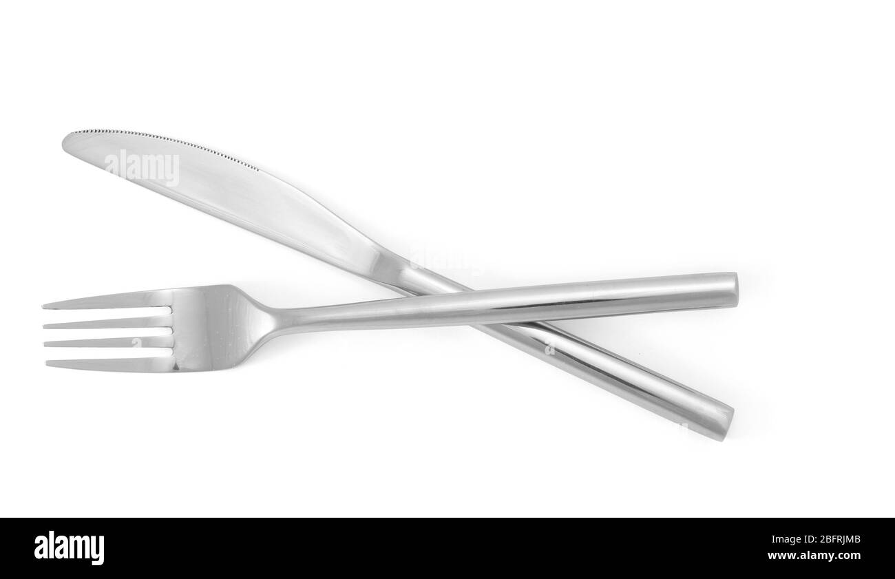 Silver fork and knife isolated on white Stock Photo - Alamy