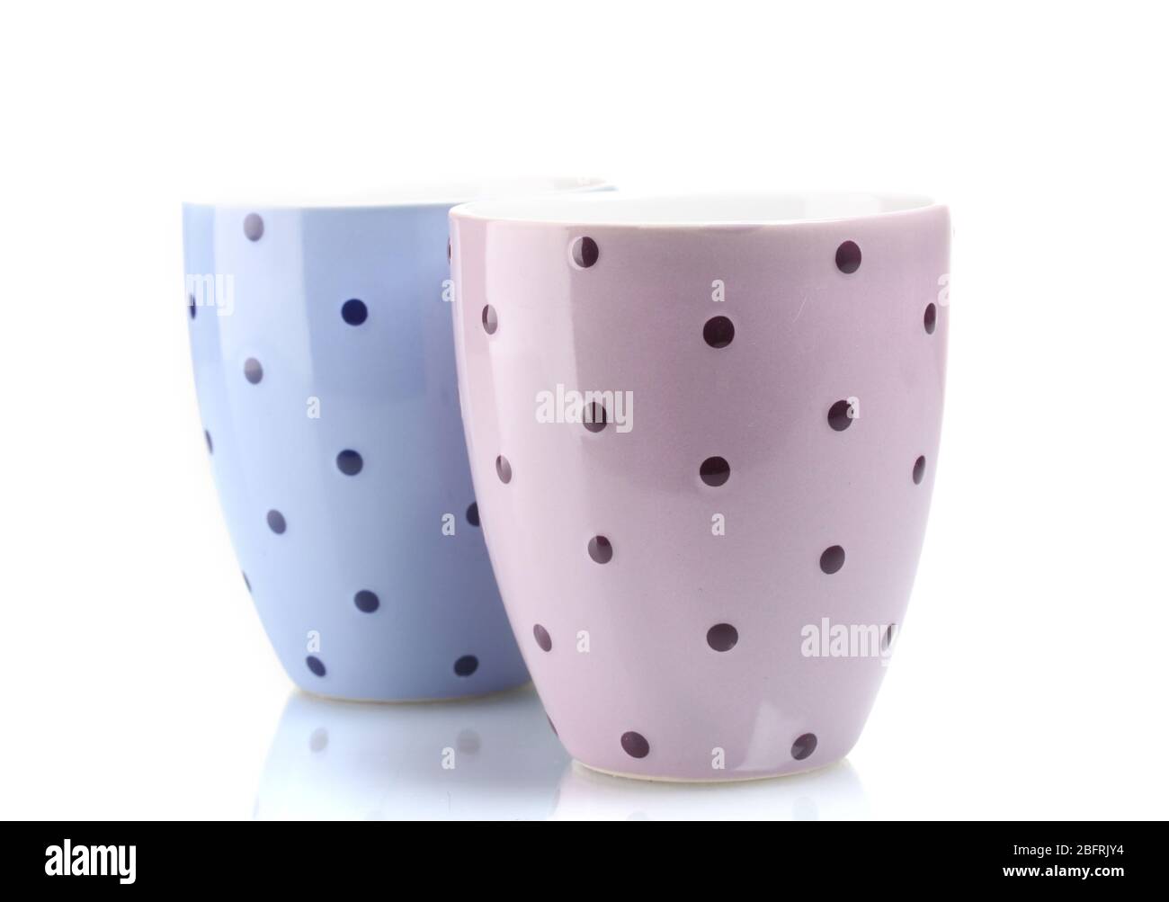 Two color cups isolated on white Stock Photo - Alamy