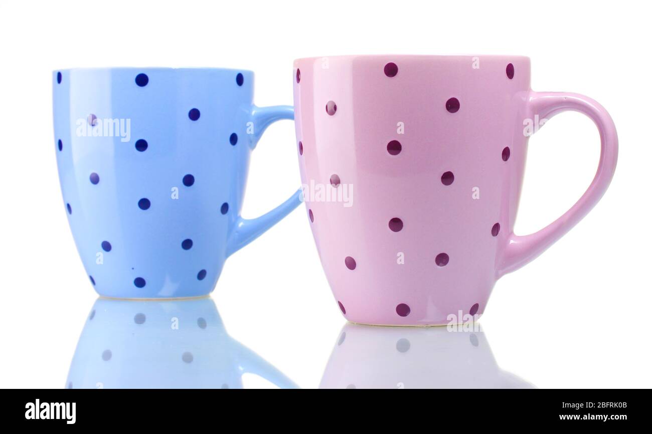 Two color cups isolated on white Stock Photo - Alamy