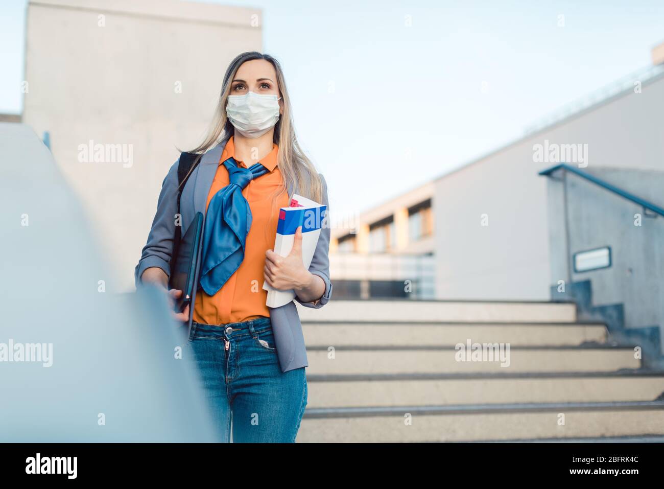 Lonely student on college campus closed due to covid-19 Stock Photo - Alamy