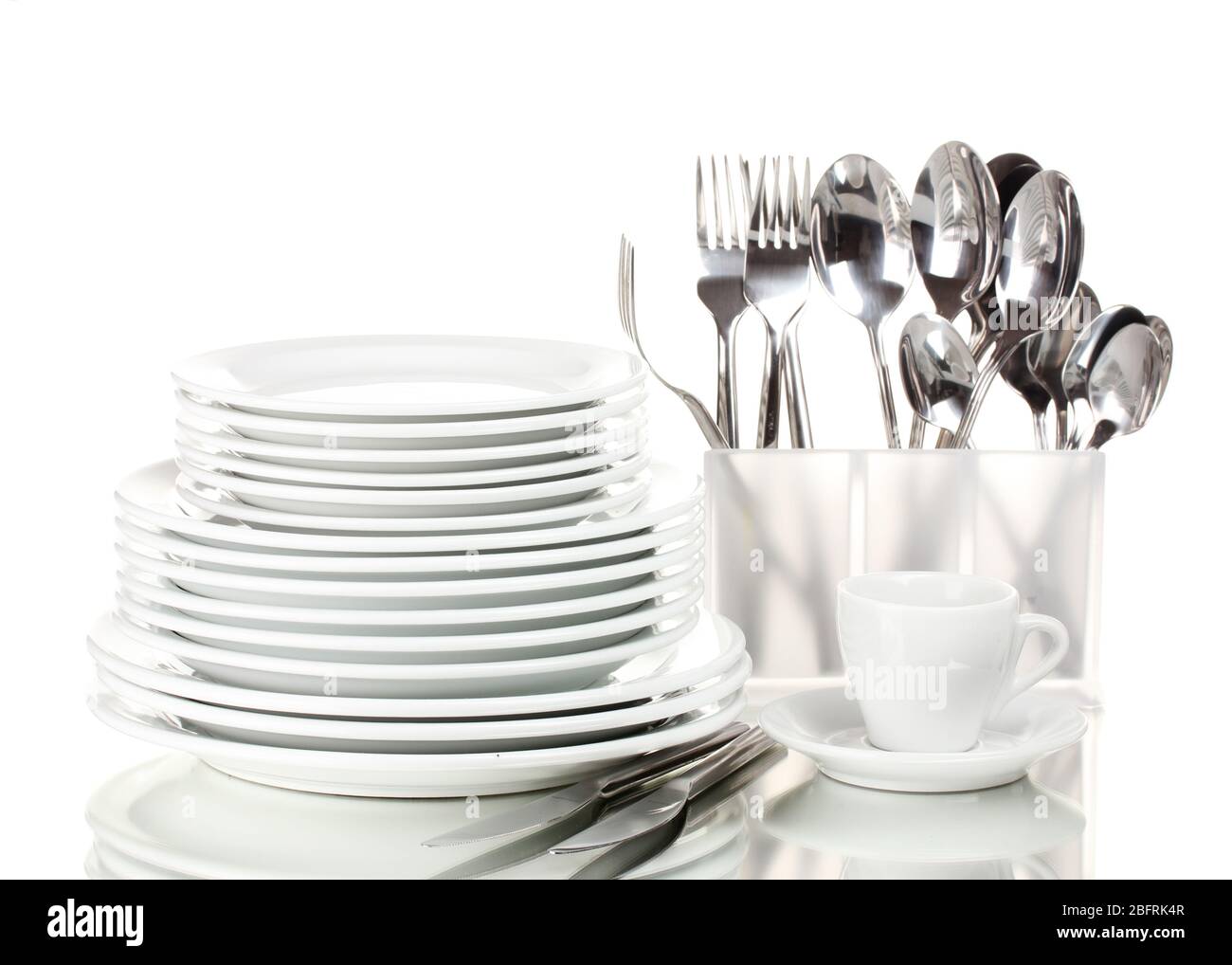 Clean plates and cutlery isolated on white Stock Photo - Alamy