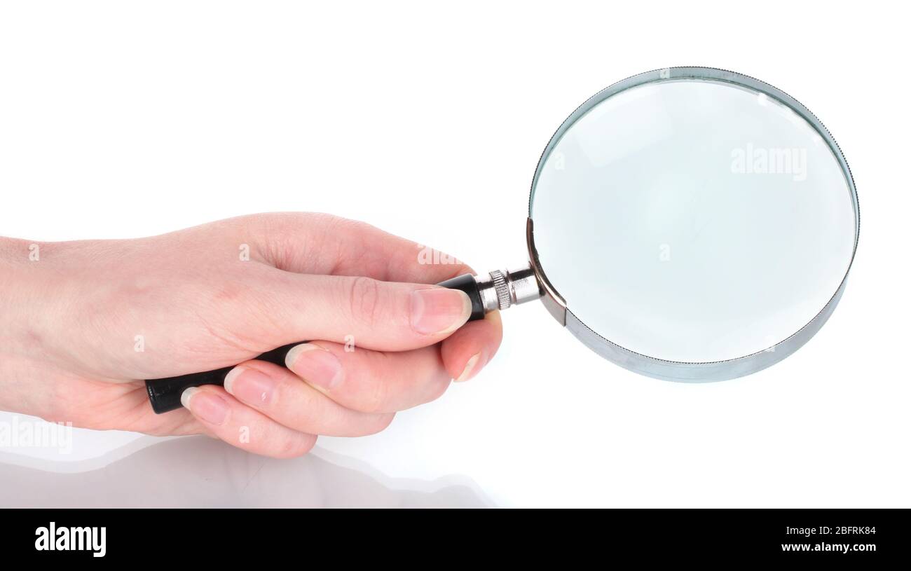 Magnifying glass in hand isolated on white Stock Photo - Alamy