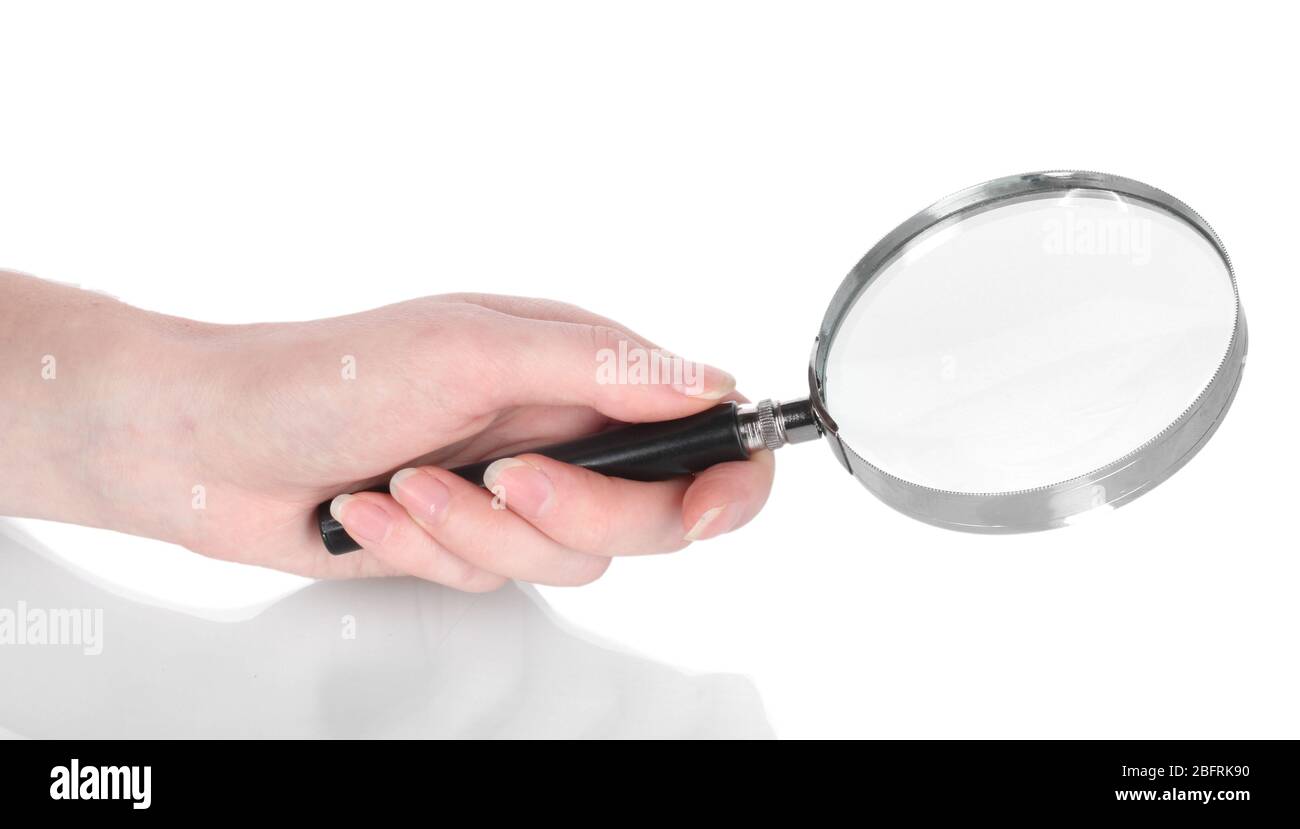 Magnifying glass in hand isolated on white Stock Photo - Alamy