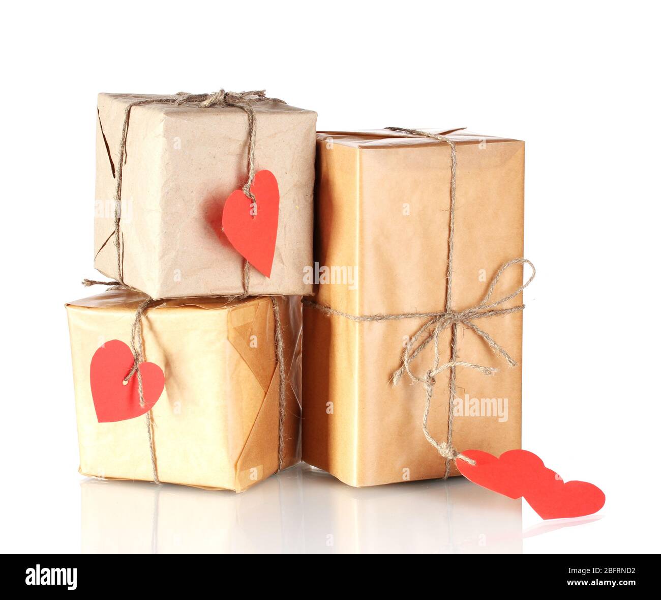 Three parcels with blank heart-shaped labels isolated on white Stock ...