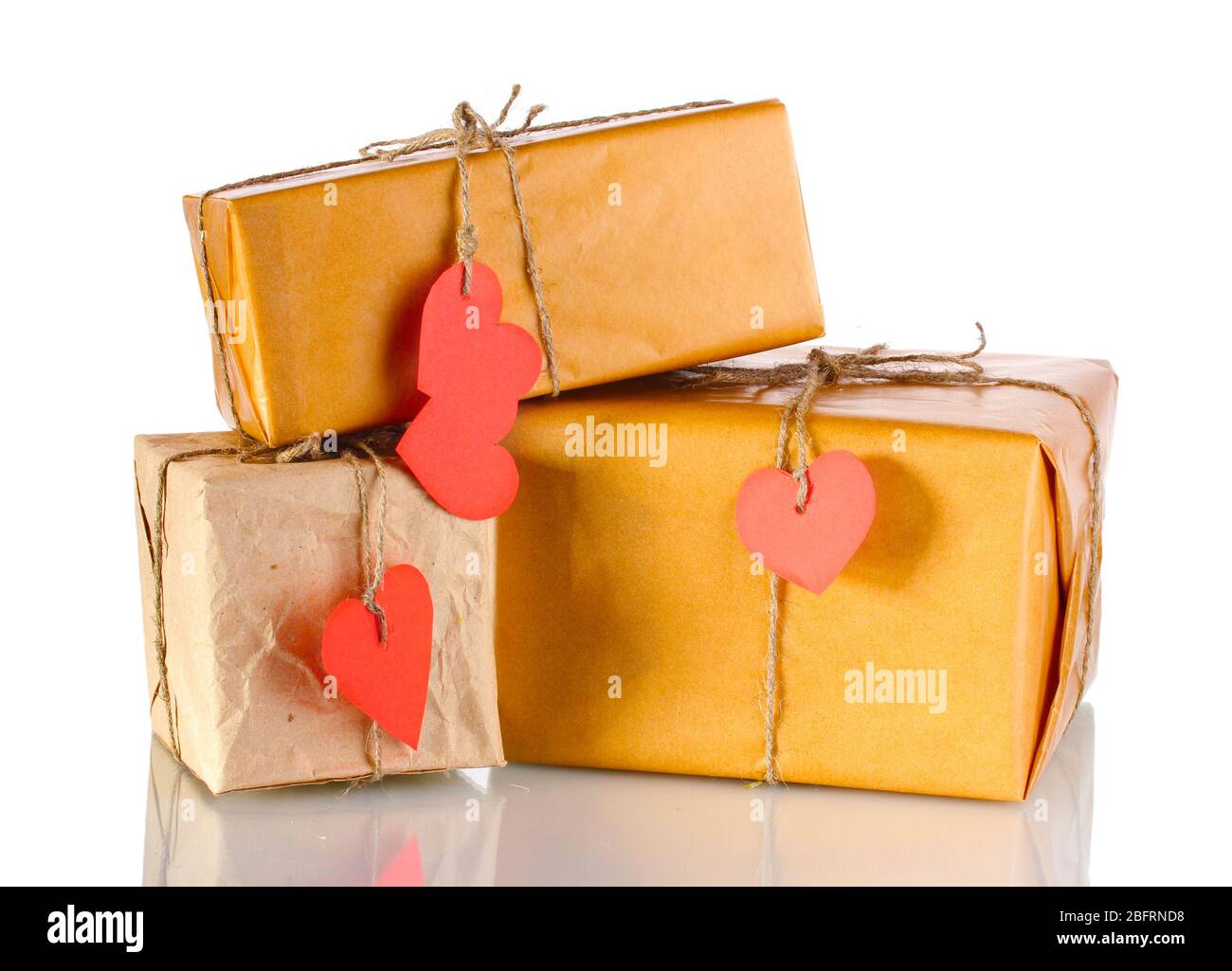 Three parcels with blank heart-shaped labels isolated on white Stock ...