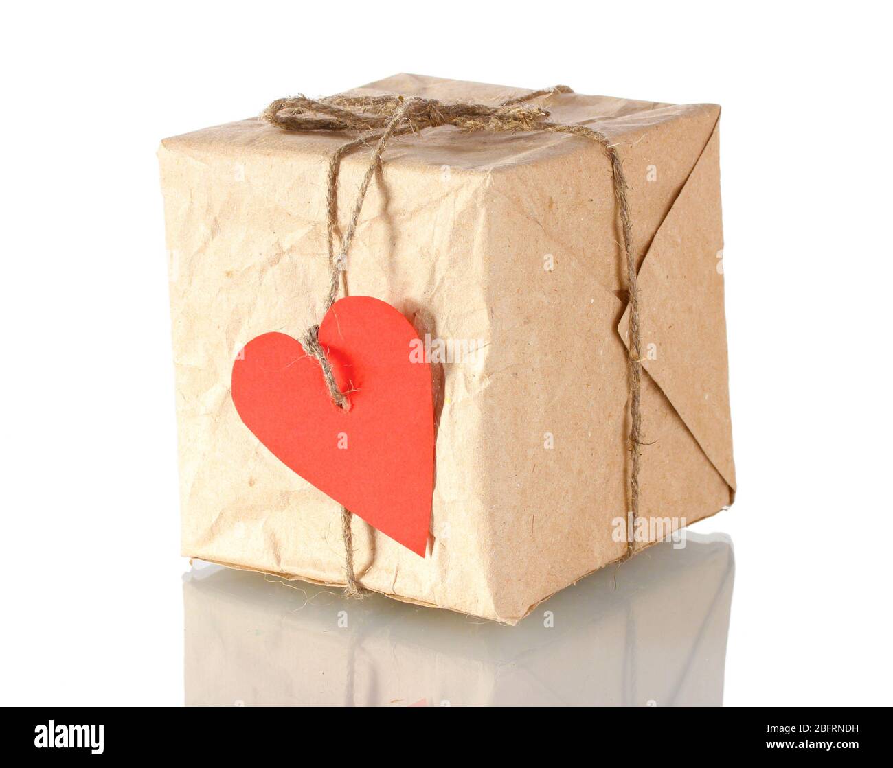 Small parcel with blank heart-shaped label isolated on white Stock ...