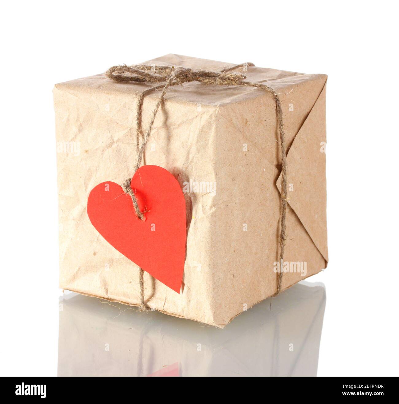 Small parcel with blank heart-shaped label isolated on white Stock ...