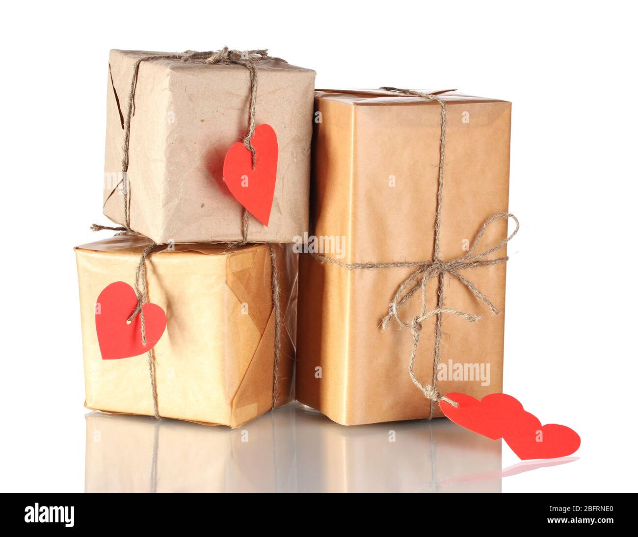 Three parcels with blank heart-shaped labels isolated on white Stock ...