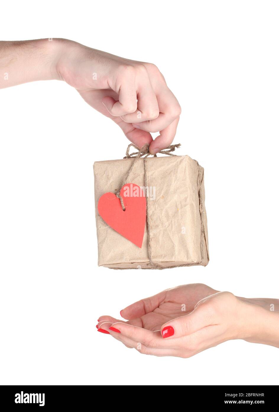 Man's hand giving parcel with blank heart-shaped label to woman ...