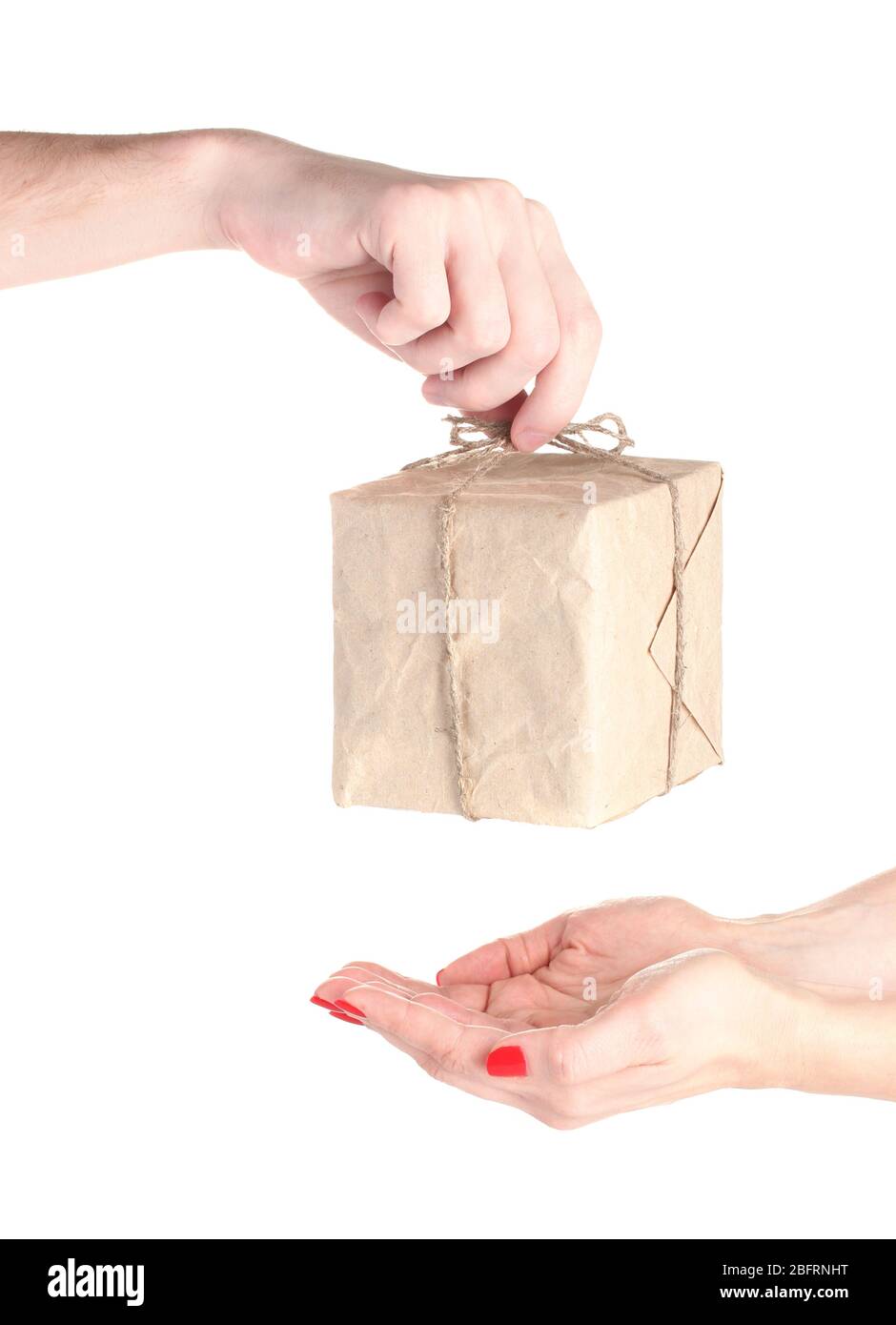 Man's hand giving parcel with blank heart-shaped label to woman ...