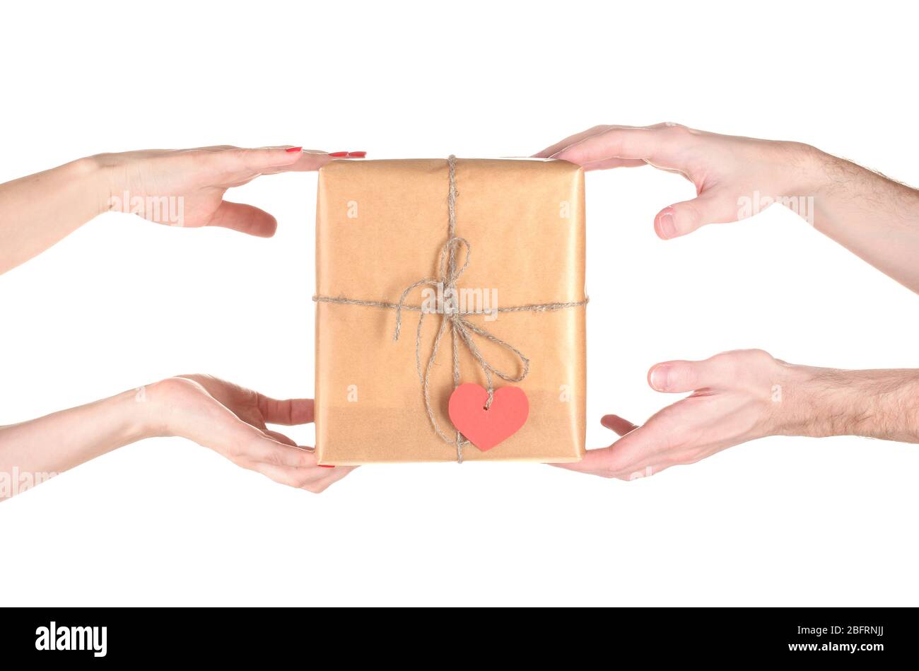 Woman's hand giving parcel with blank heart-shaped label to man ...