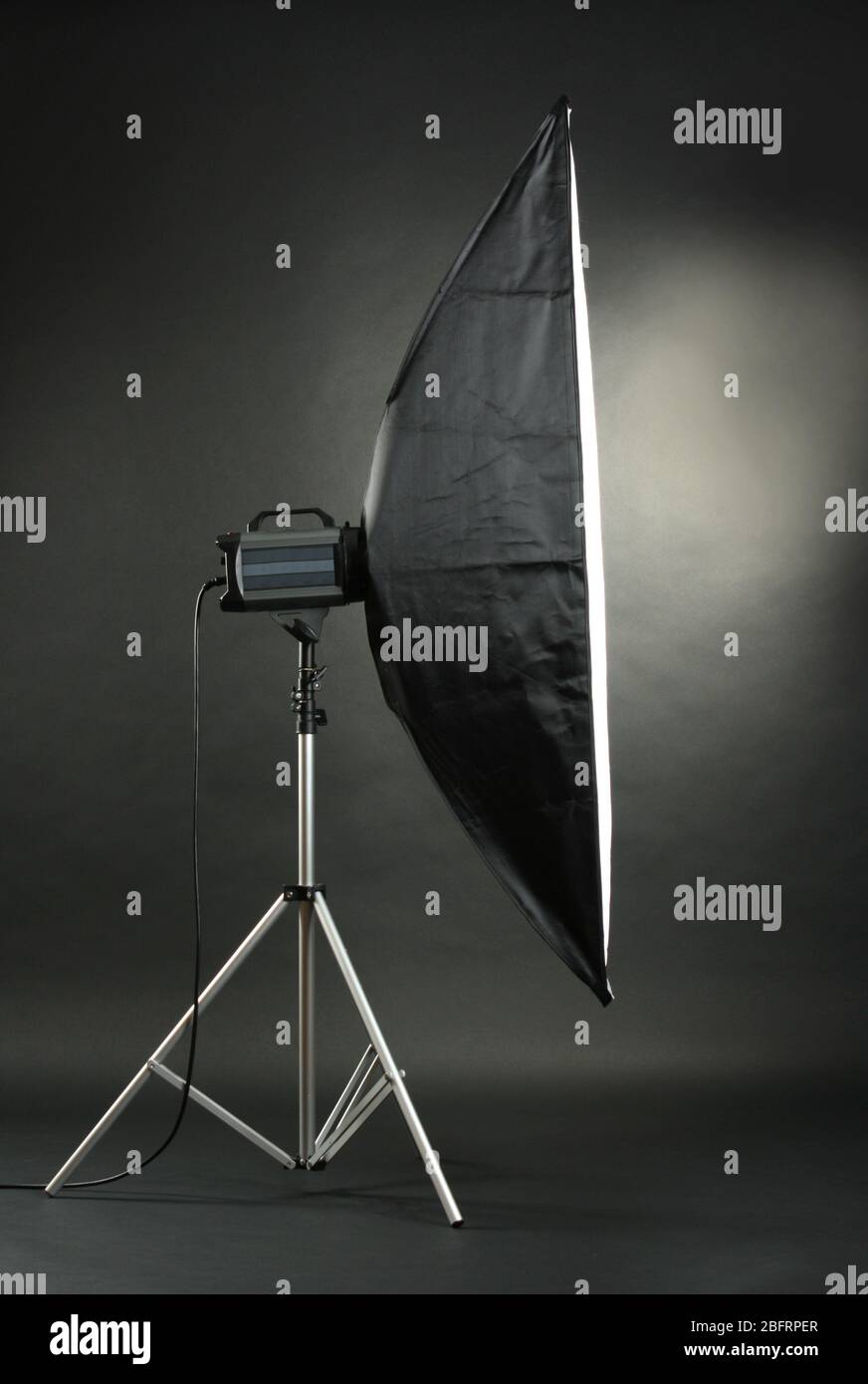 Studio flash with soft-box on black studio background Stock Photo - Alamy