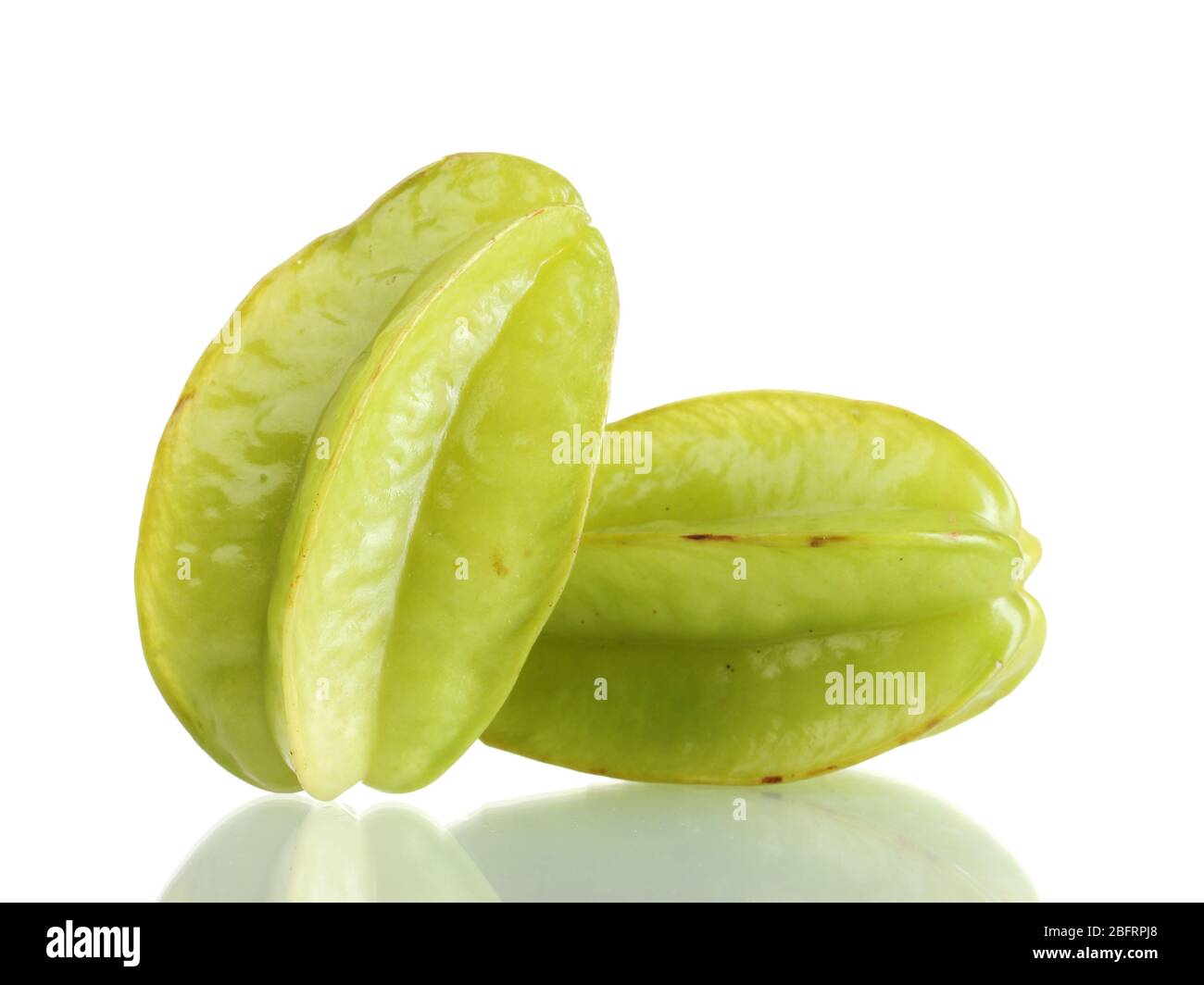 two fresh carambola fruits isolated on white Stock Photo - Alamy