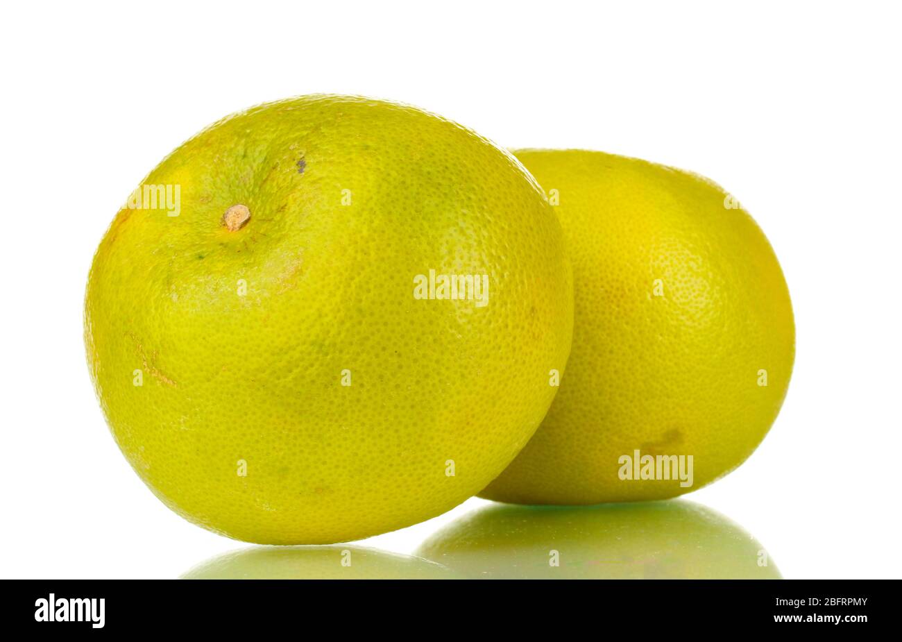 two green grapefruits isolated on white Stock Photo - Alamy