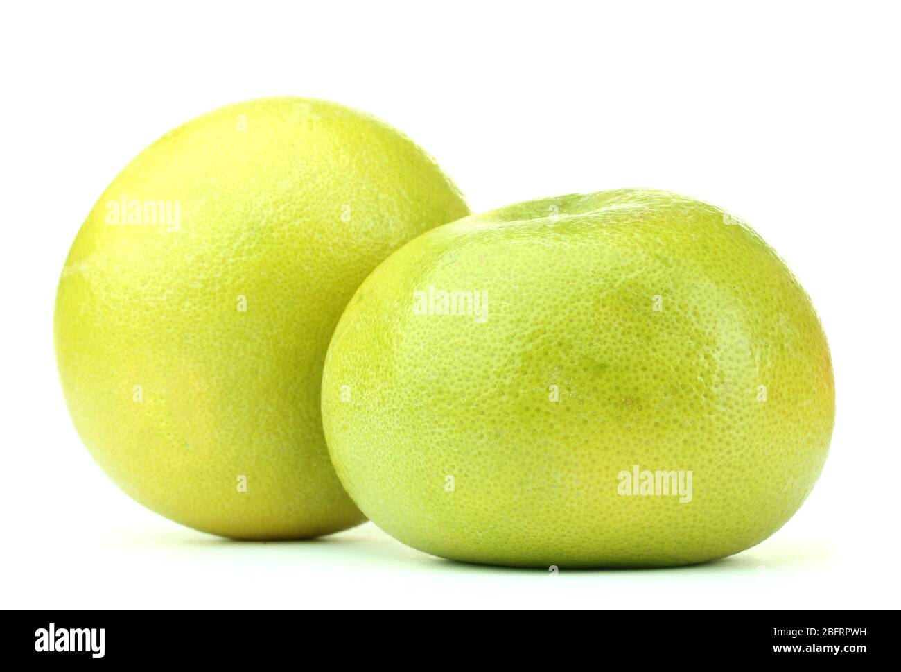 two green grapefruits isolated on white Stock Photo - Alamy