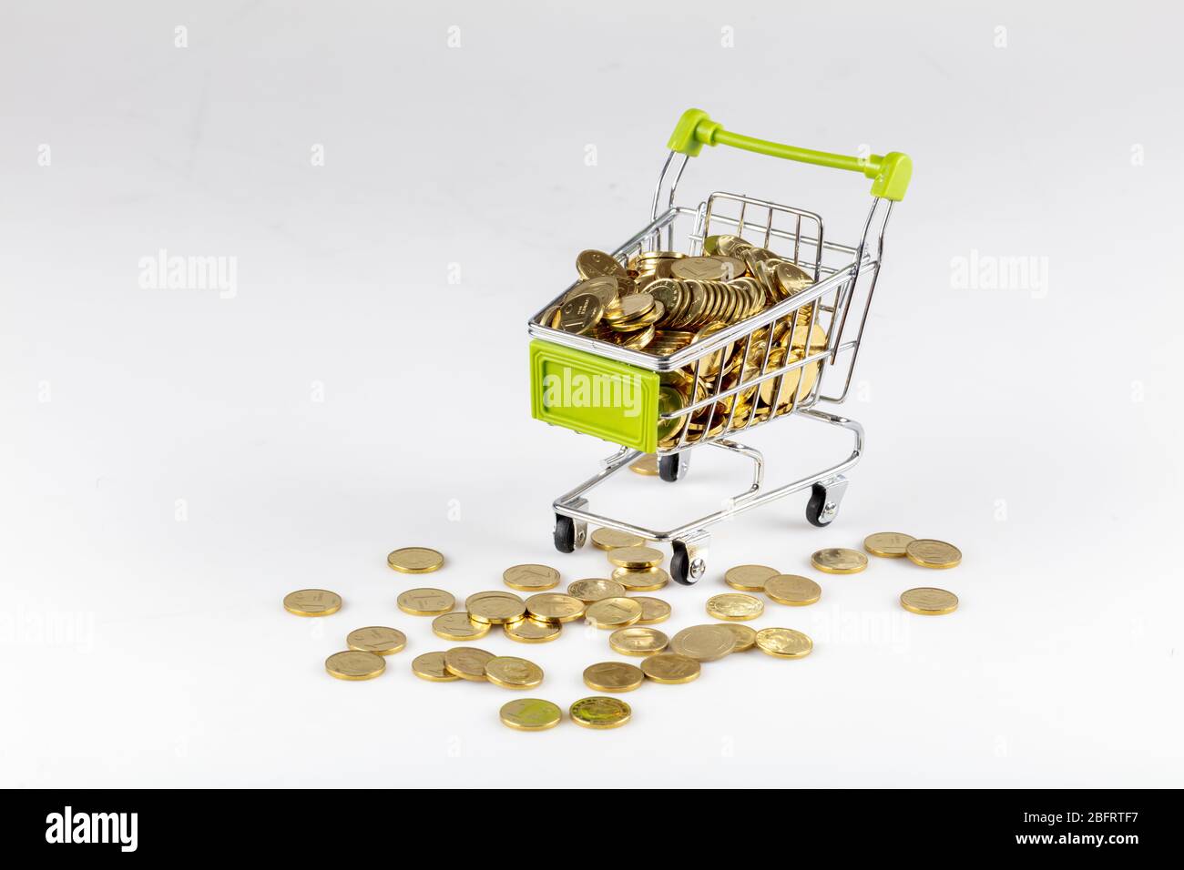 Miniature people : Family go shopping / buying with cart on stack of ...