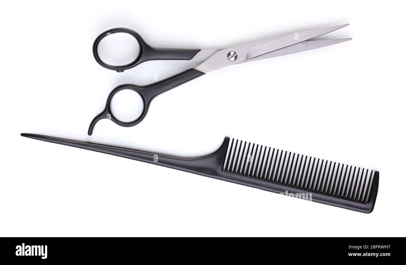 Hair cutting shears and comb isolated on white Stock Photo - Alamy