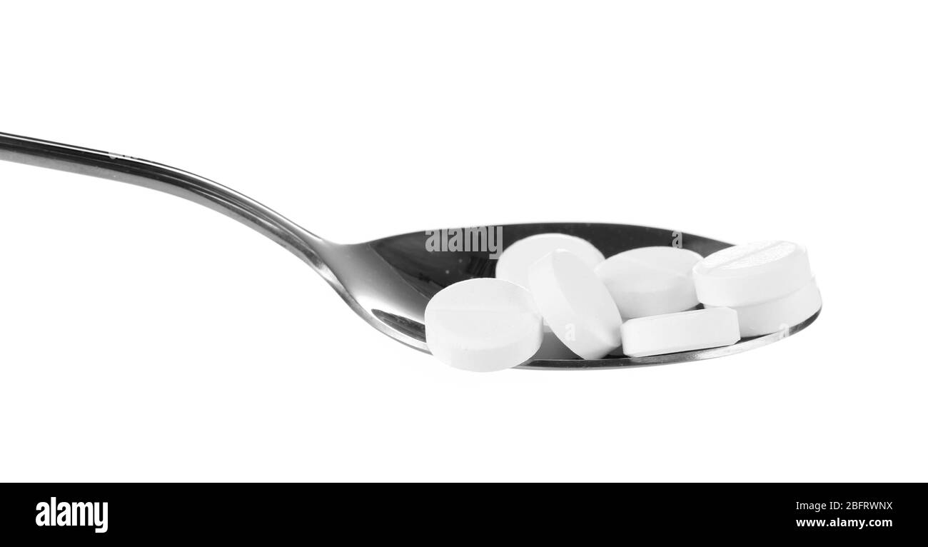 Pills capsules on yellow Black and White Stock Photos & Images - Alamy