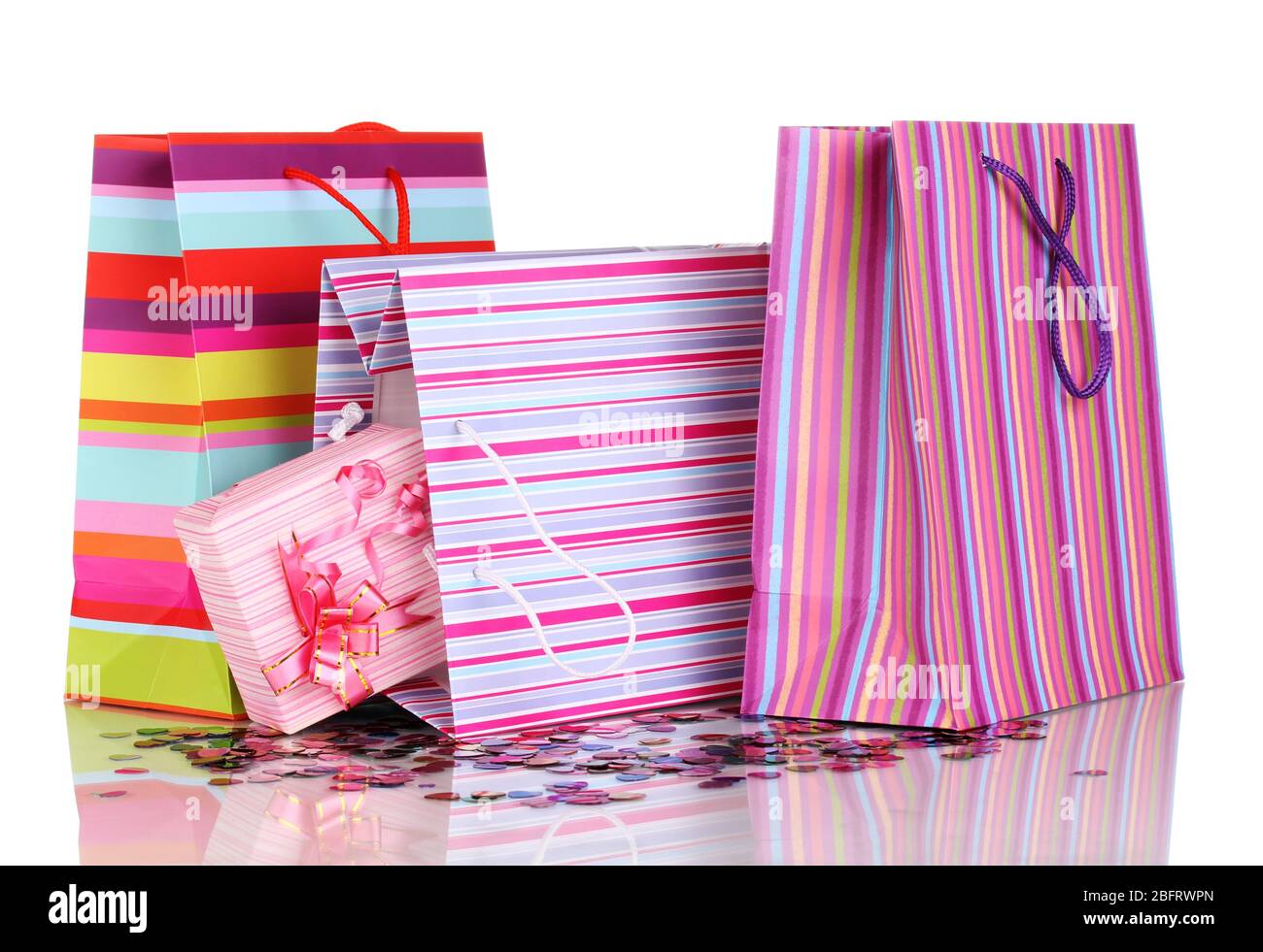 Colorful gift bags and gifts with confetti isolated on white Stock ...