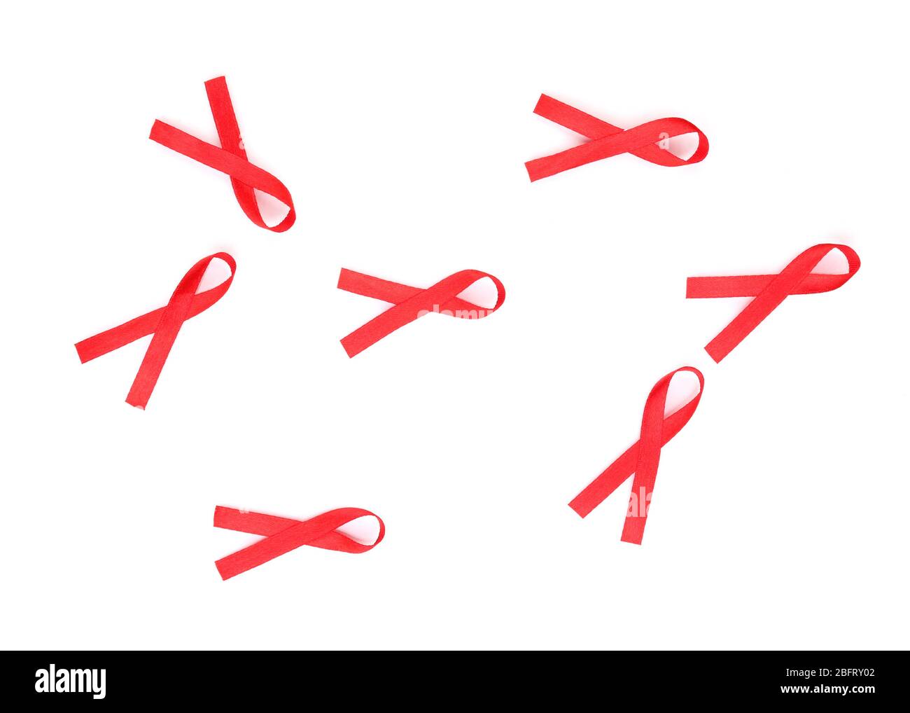 Aids awareness red ribbons isolated on white Stock Photo - Alamy