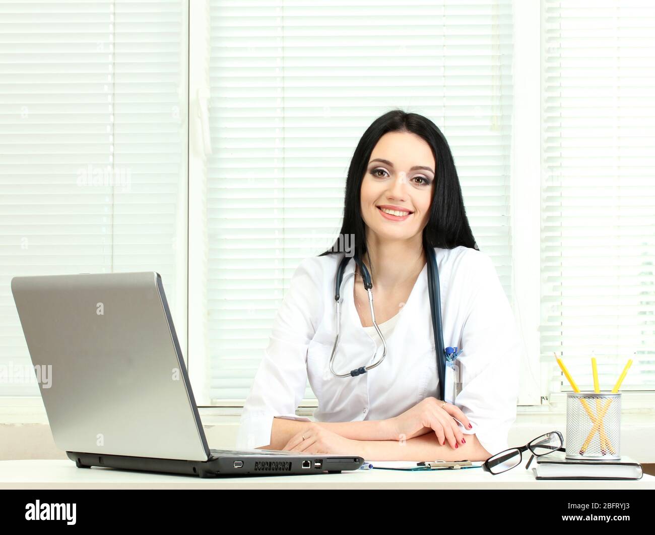beautiful girl doctor in the office Stock Photo - Alamy