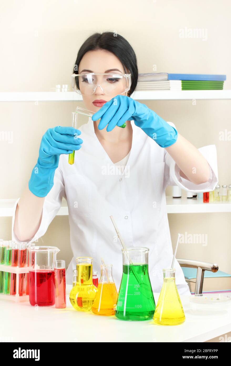 Young female scientist looking in chemistry laboratory Stock Photo - Alamy