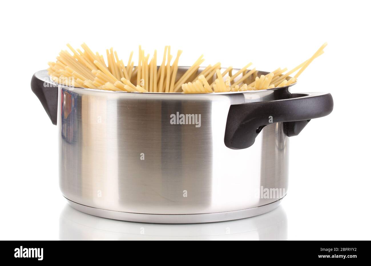 Spaghetti in pot isolated on white Stock Photo - Alamy