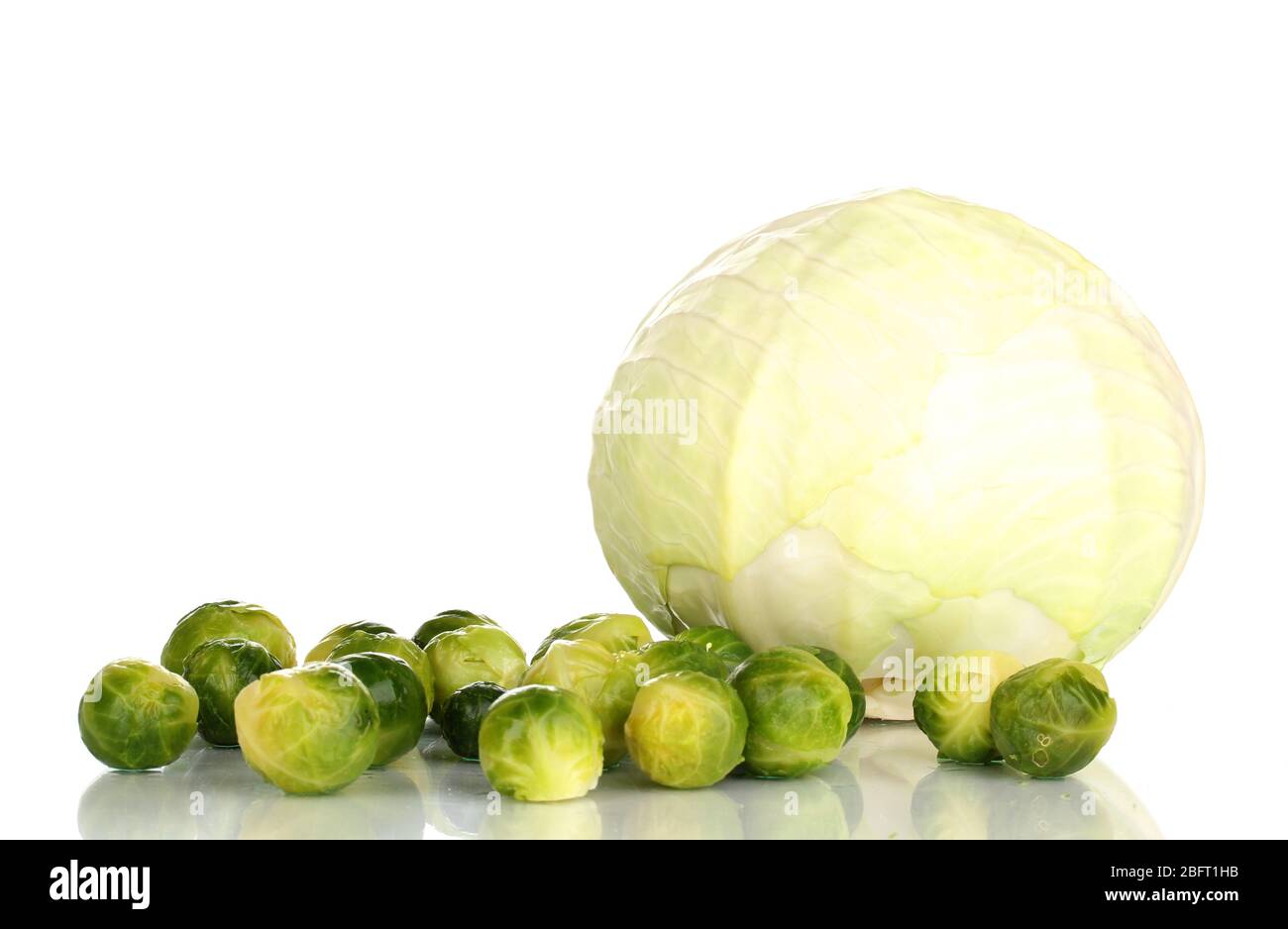 Fresh brussels sprouts and green cabbage isolated on white Stock Photo ...